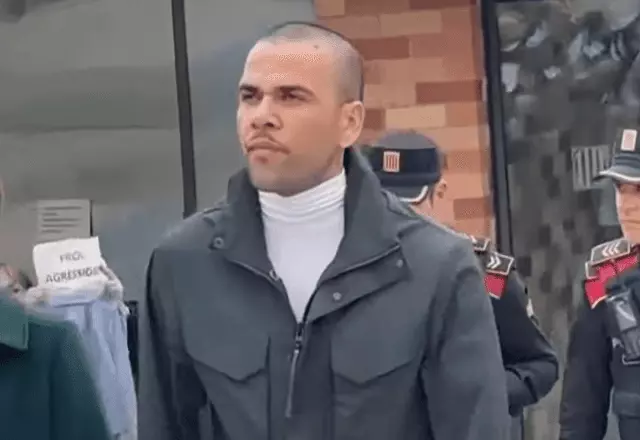 Daniel Alves celebrates after leaving prison in Spain